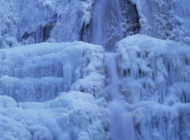 Waterfall iced over in winter in Franche-Comte, France, Europe ...