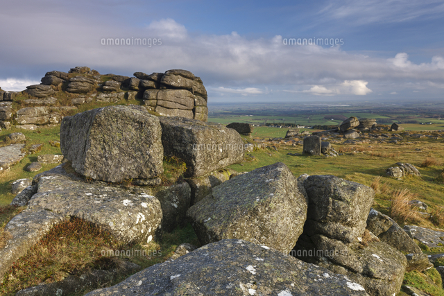 Early morning sunlight illuminates the granite rocks of Rowtor in the ...