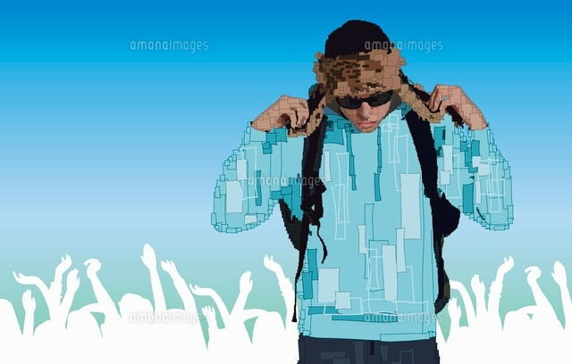 Young man wearing fur hat and backpack at concert[20039002674]の写真素材 ...