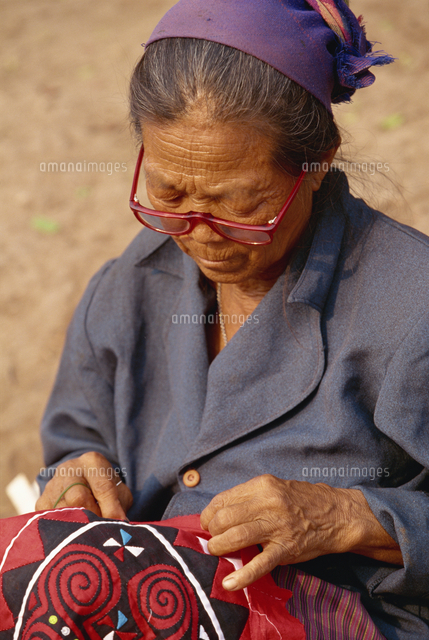 Hmong lady stitching at market, Luang Prabang, Laos, Indochina ...