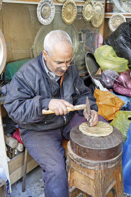 Copper worker in Copper Souq, Ghizdara Street, Tripoli, Libya, North ...
