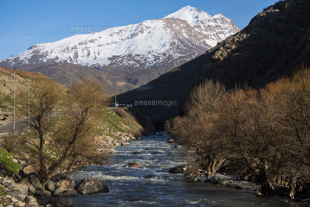 Snow capped mountains above the great Zab River along the Hamilton road ...