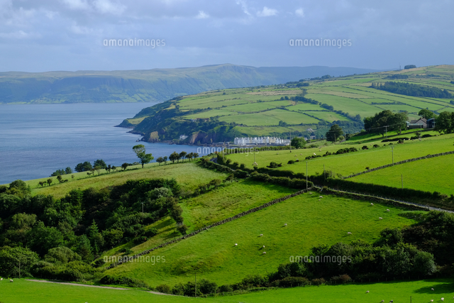 Pastures and fields and the little village of Cushendun, Antrim County ...