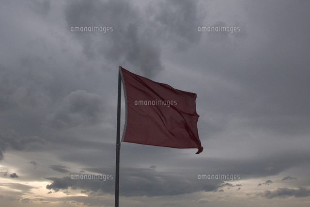Red flag flying on beach against cloudy sky. Liverpool, UK[20071005001 ...