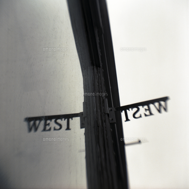 West signs indicator on the top of Empire States Building. Manhattan ...