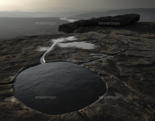 Circular pool carved into rock. Stanage Edge, Peak District, England ...