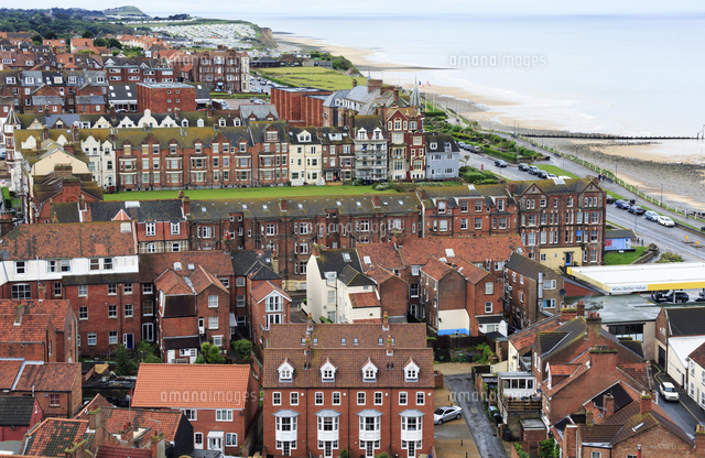England, Norfolk, Cromer. Aerial view of Cromer rooftops and beach ...