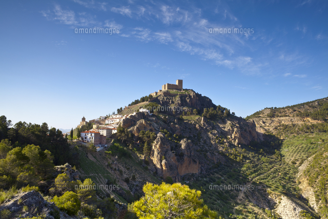 The Mudejar Castle overlooking the mountain village of Segura de la ...