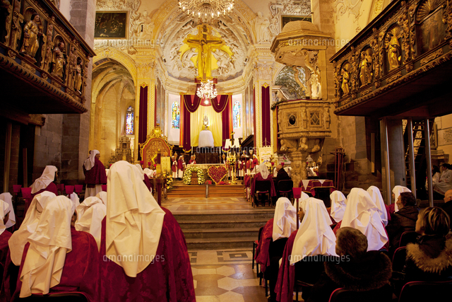 Italy, Sicily, Enna. Participants of the holy week processions inside ...
