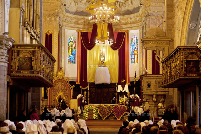 Italy, Sicily, Enna. Participants of the holy week processions inside ...