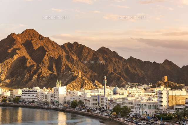 Oman, Muscat. Cityscape of Mutrah old town, elevated view, at sunset ...