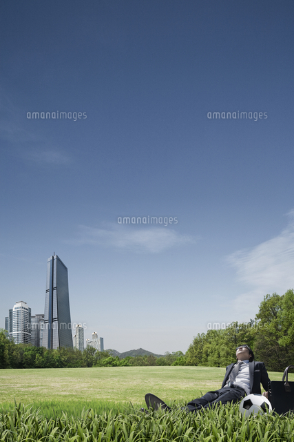 businessman taking a break on grass, Computer-Generated, computer ...