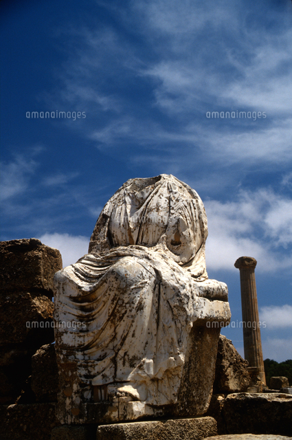 A seated female statue in the Tholos of Demeter and her daug ...