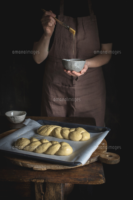 Challah bread (Jewish cuisine) being made: yeast dough plaits being ...