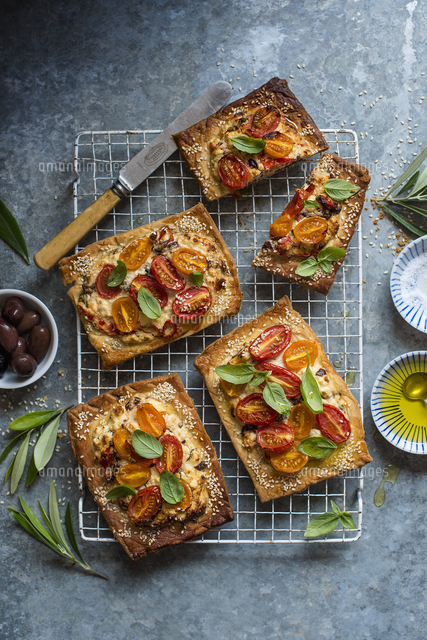 Feta cheese, olive, tomato shortcrust pastry tarts with sesame seeds ...