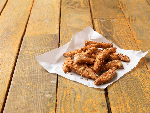 Food, fish, super seeded lightly dusted plaice goujons, painted yellow ...