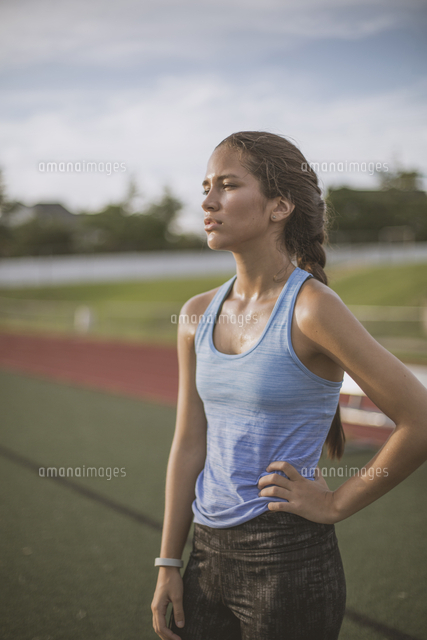 Mixed race athlete standing on sports field[11018057087]の写真素材・イラスト素材 ...