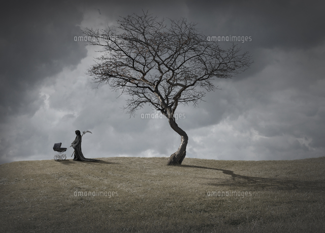 Man in black robes with baby carriage by dead tree[11018082794]の写真素材 ...
