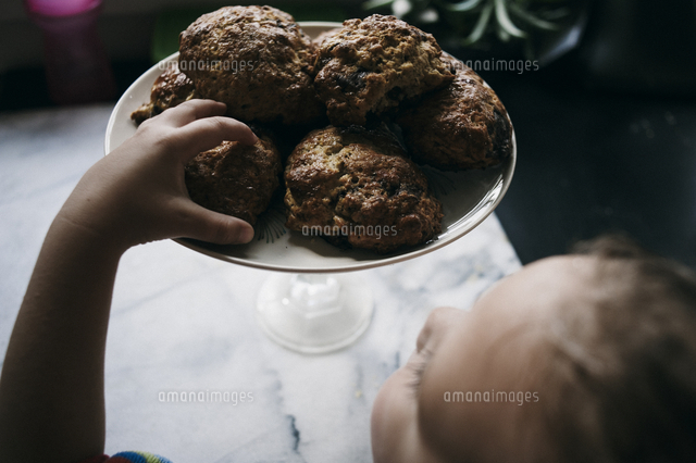 Girl reaching for cookie on kitchen counter[11018089027]の写真素材・イラスト素材 ...