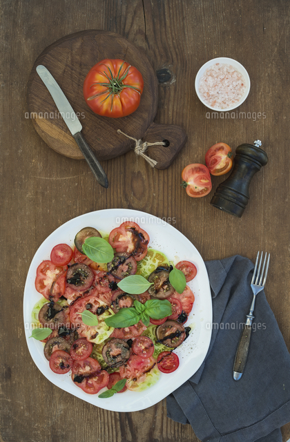 Ripe village heirloom tomato salad with olive oil, basil and spices ...