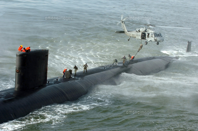 Soldiers perform a fast-roping exercise from a MH-60S Seahaw ...