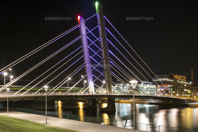 Finland, Helsinki, Ruoholahti, Illuminated suspension bridge ...