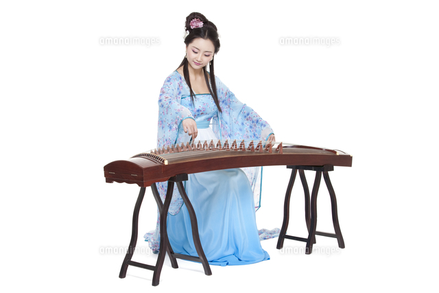 Young woman in Chinese traditional costume plucking Chinese[11091001223 ...