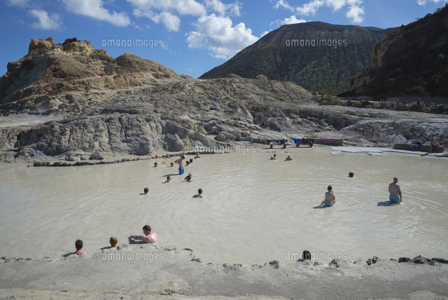 Bathers enjoying the therapeutic benefits of the volcanic mud in the ...
