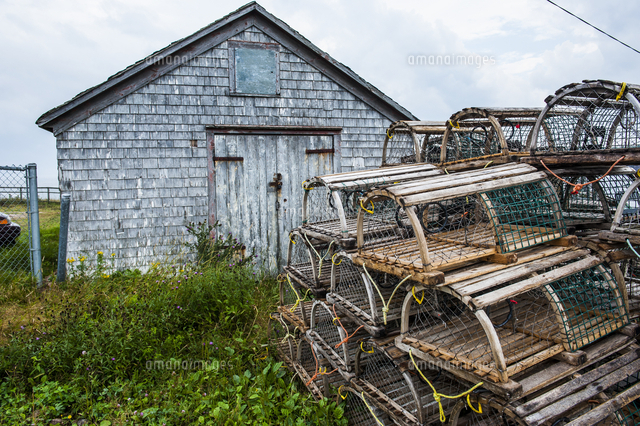 Fish traps in front of a shingle hut in Neils Harbour, Cape Breton ...