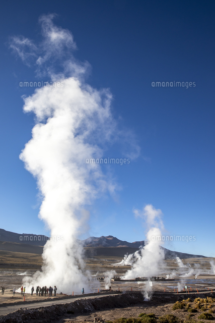 Tourists at the Geysers del Tatio (El Tatio), the third largest geyser ...